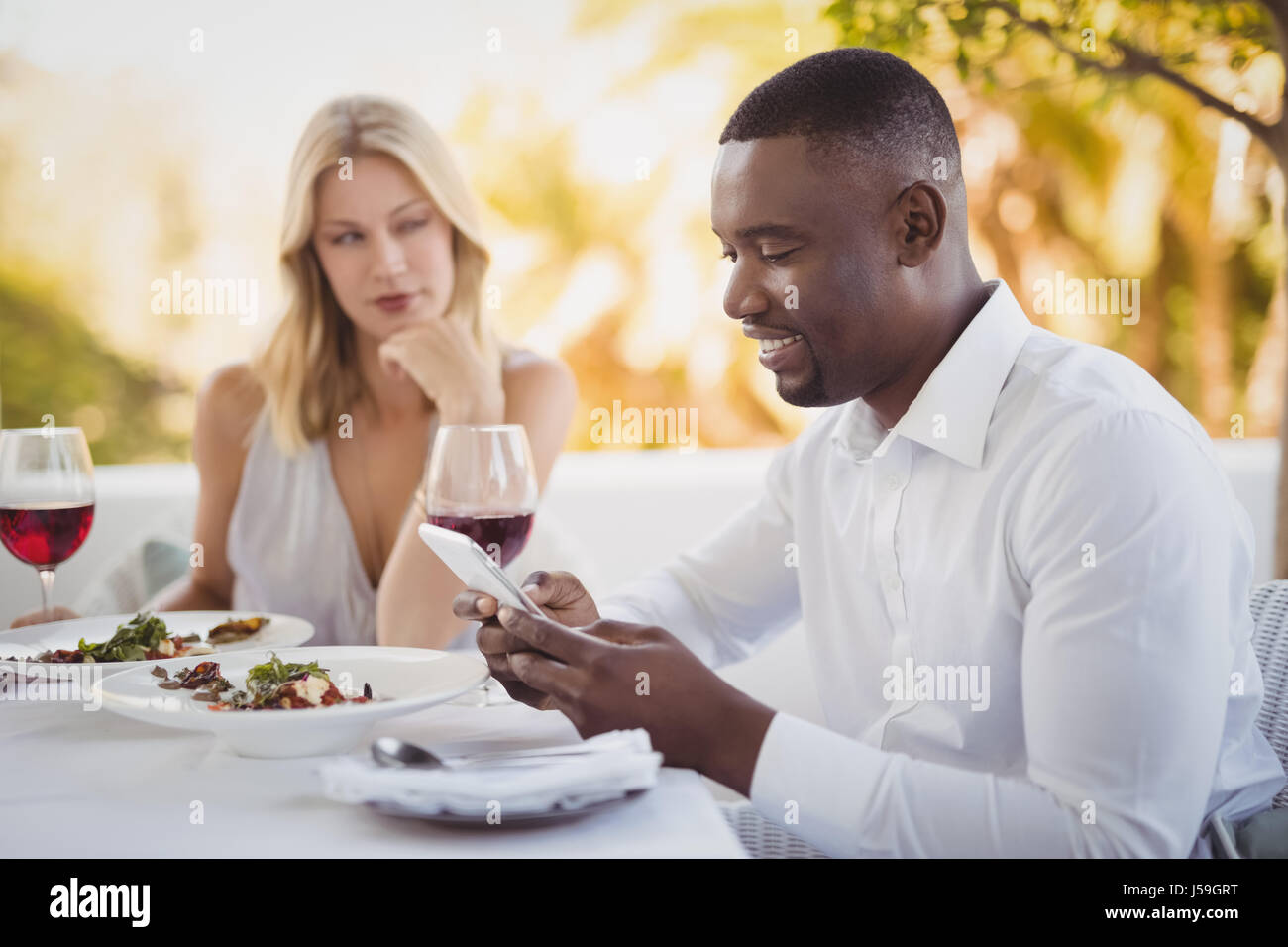Man and texting and woman unhappy hi-res stock photography and images ...