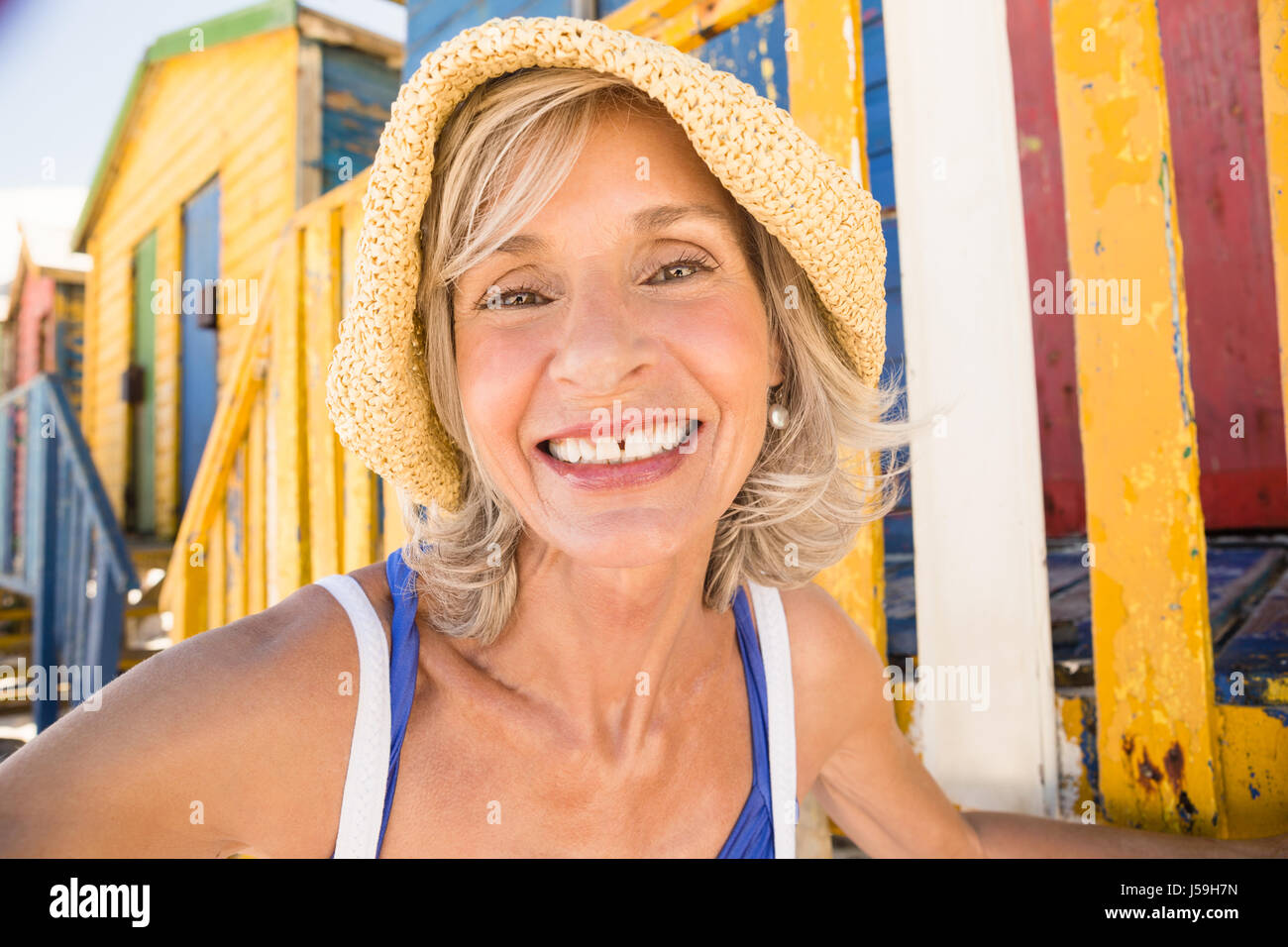 Woman walking sand beach huts architecture hi-res stock photography and ...