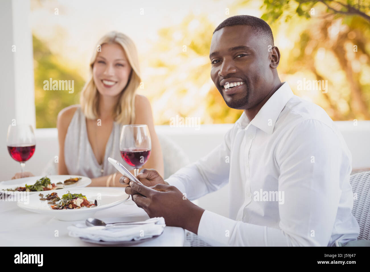Using mobile phone ignoring hi-res stock photography and images - Alamy