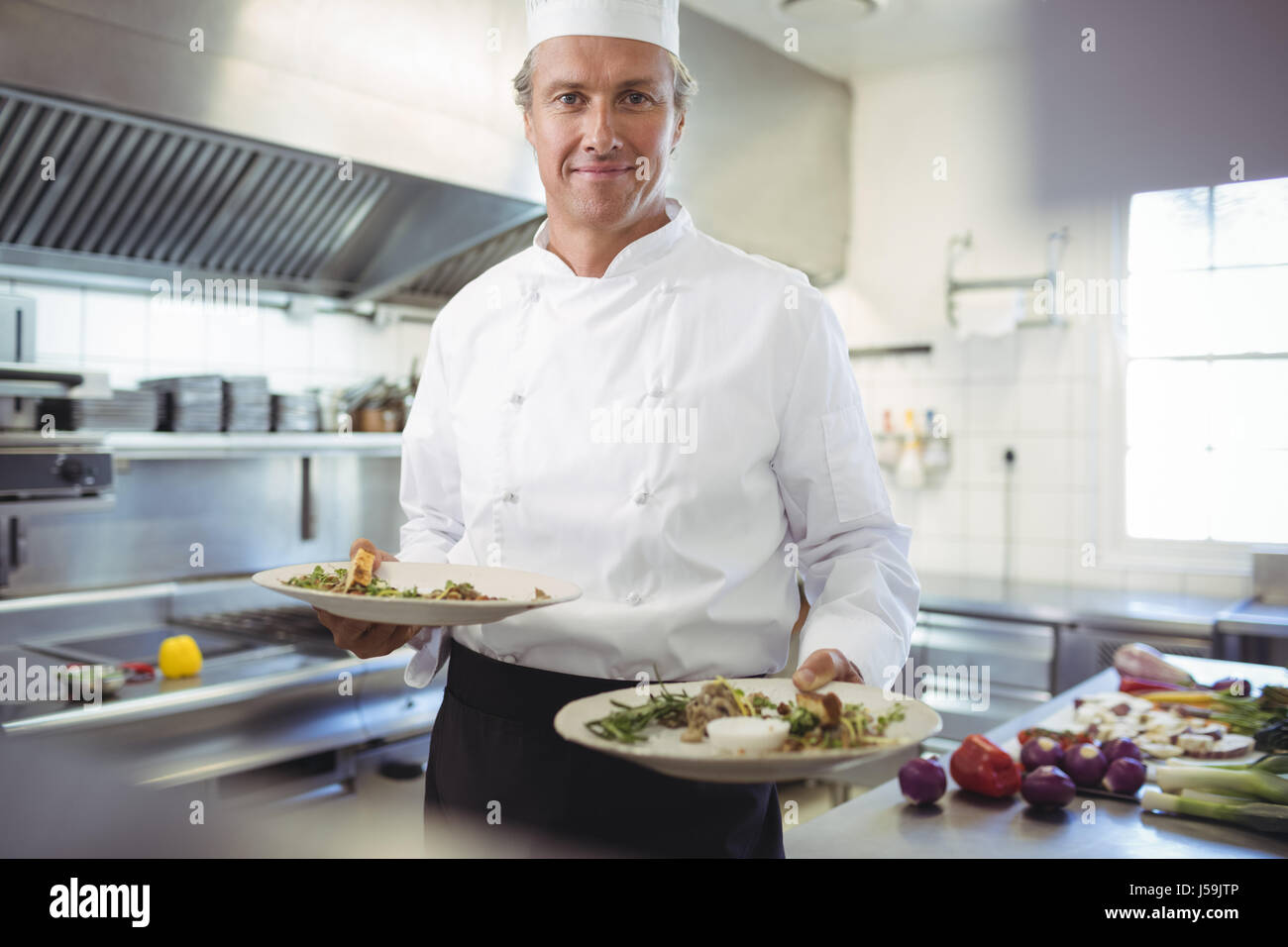 Kitchen staff preparation plates hi-res stock photography and images ...