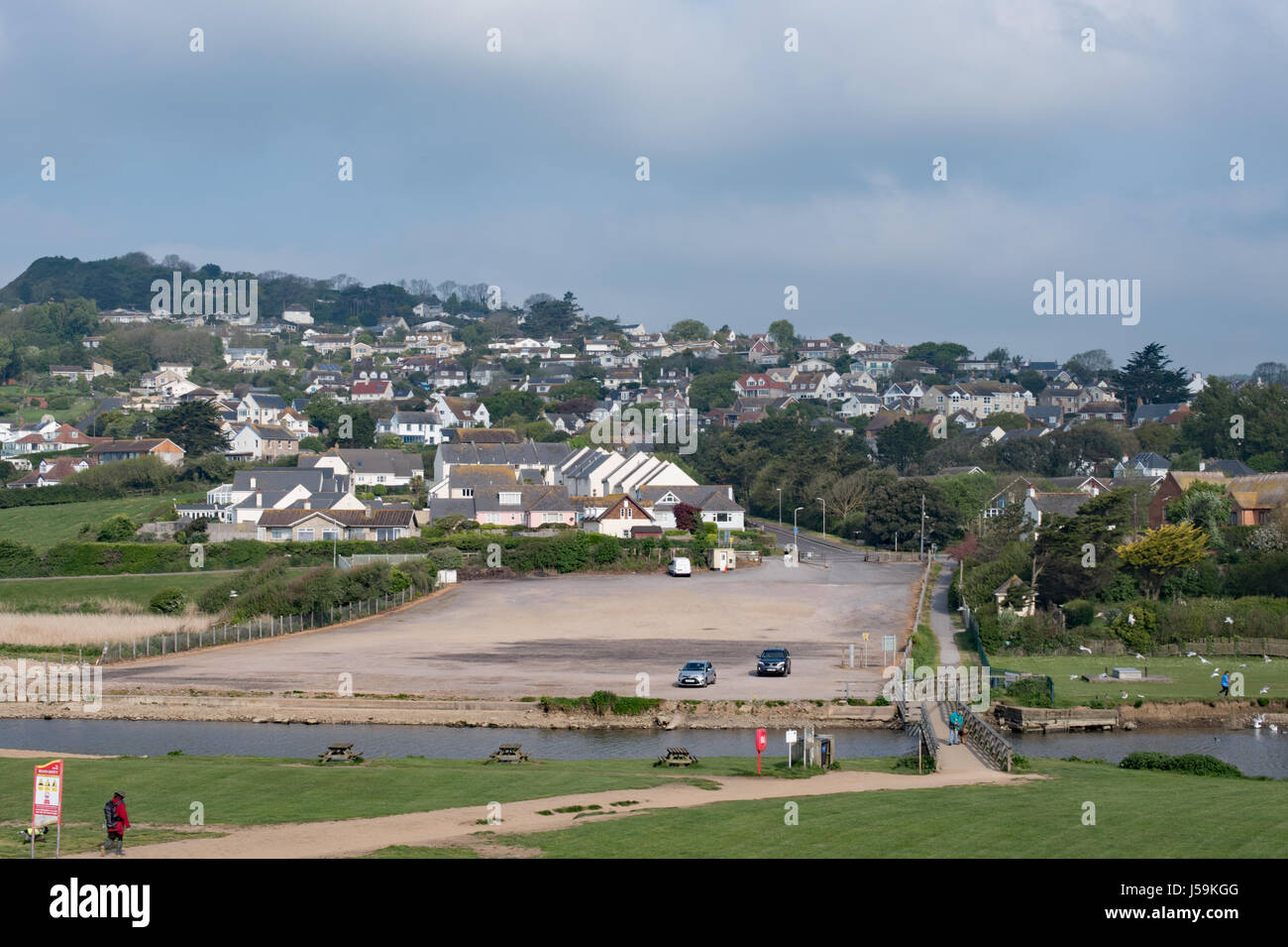The coastal town of Charmouth, with the River Char in the foreground ...