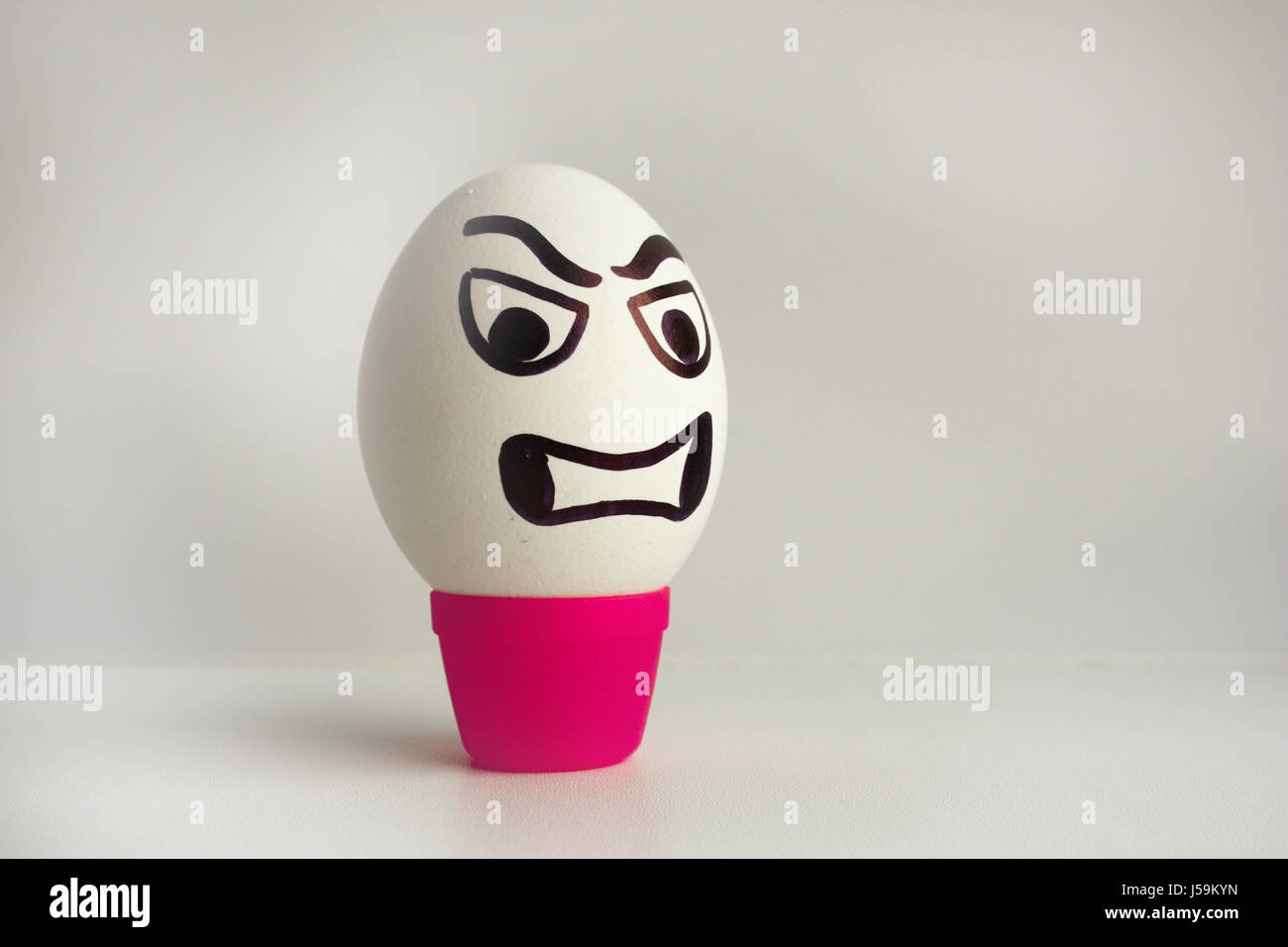 Eggs emotion concept. Clenched teeth. Angry and annoyed. Photo for your ...