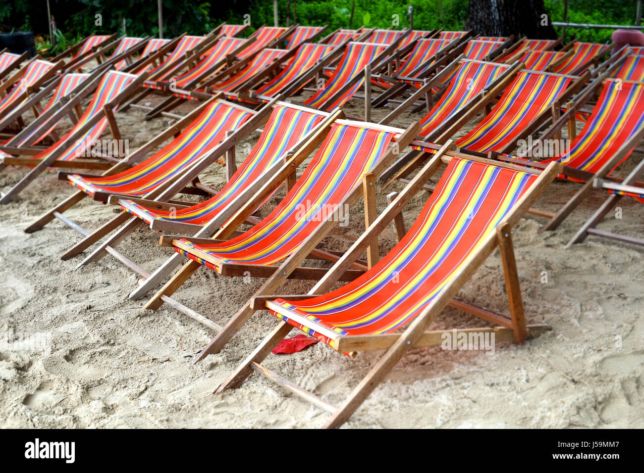 pile of relaxation sunbathing chairs on beach Stock Photo - Alamy