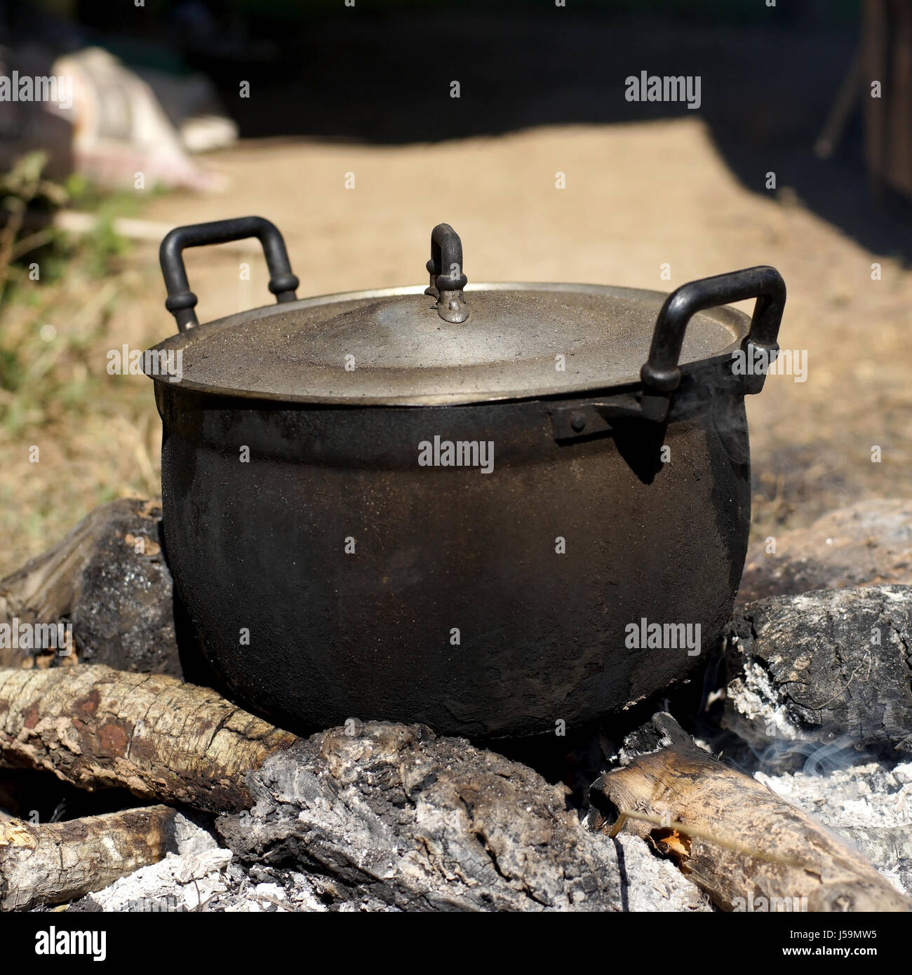 old black pot cooking on outdoor campfires Stock Photo - Alamy
