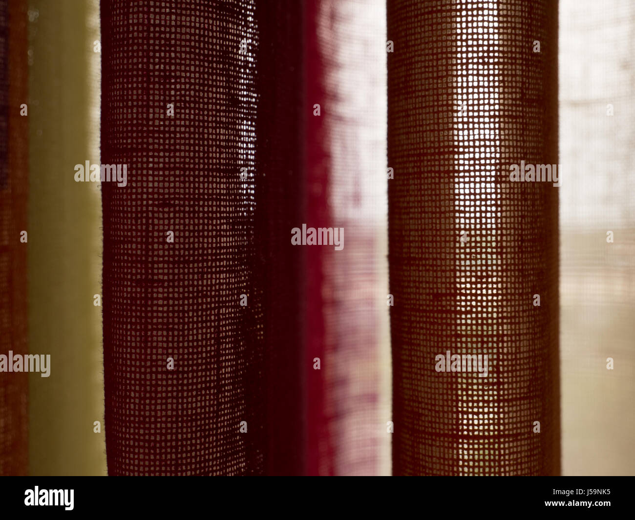 Colorful curtains letting light pass through Stock Photo - Alamy