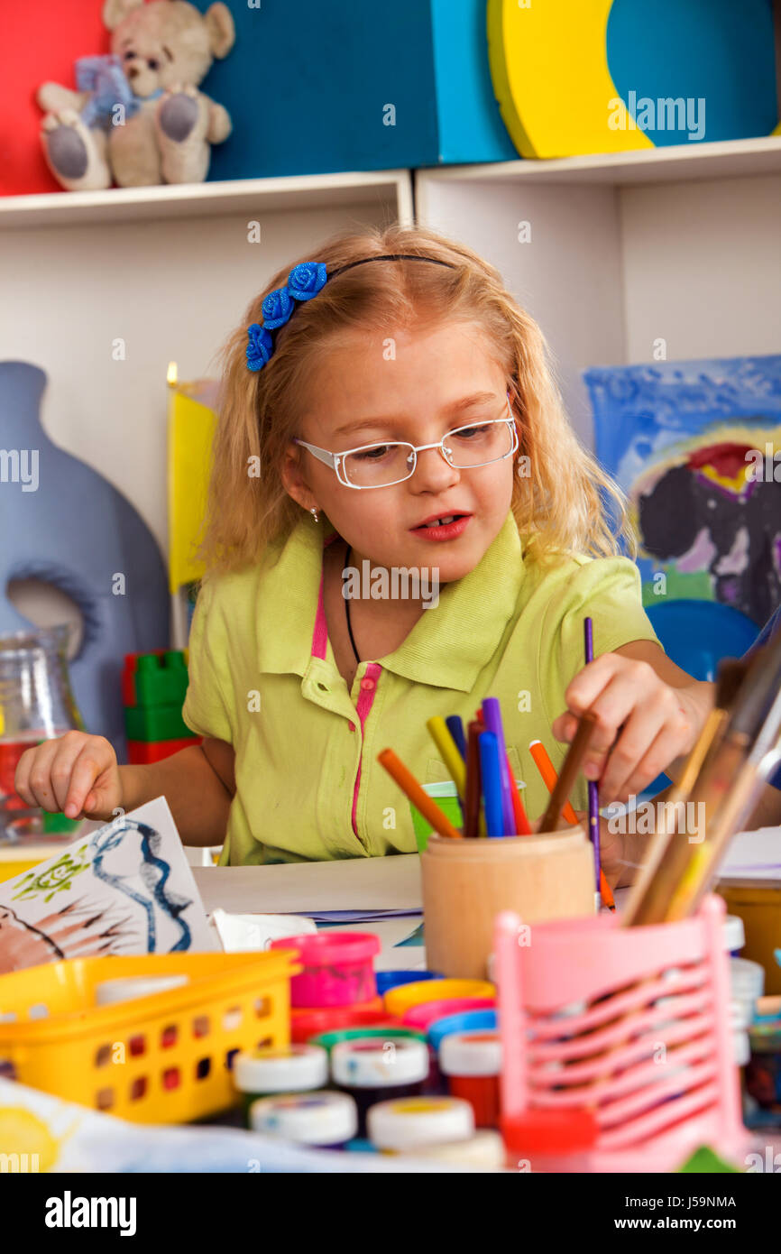 Small students girl painting in art school class Stock Photo - Alamy