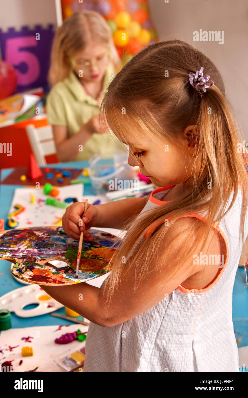 Small students girl painting in art school class Stock Photo - Alamy