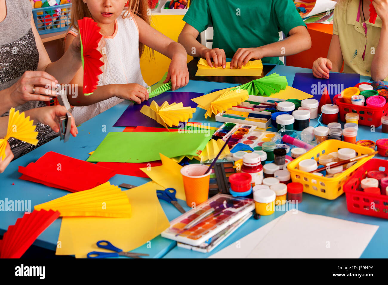School children with scissors in kids hands cutting paper Stock Photo ...