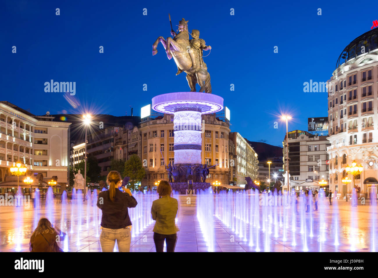 'Warrior on a Horse' statue and fountains at dusk, Macedonia Square ...