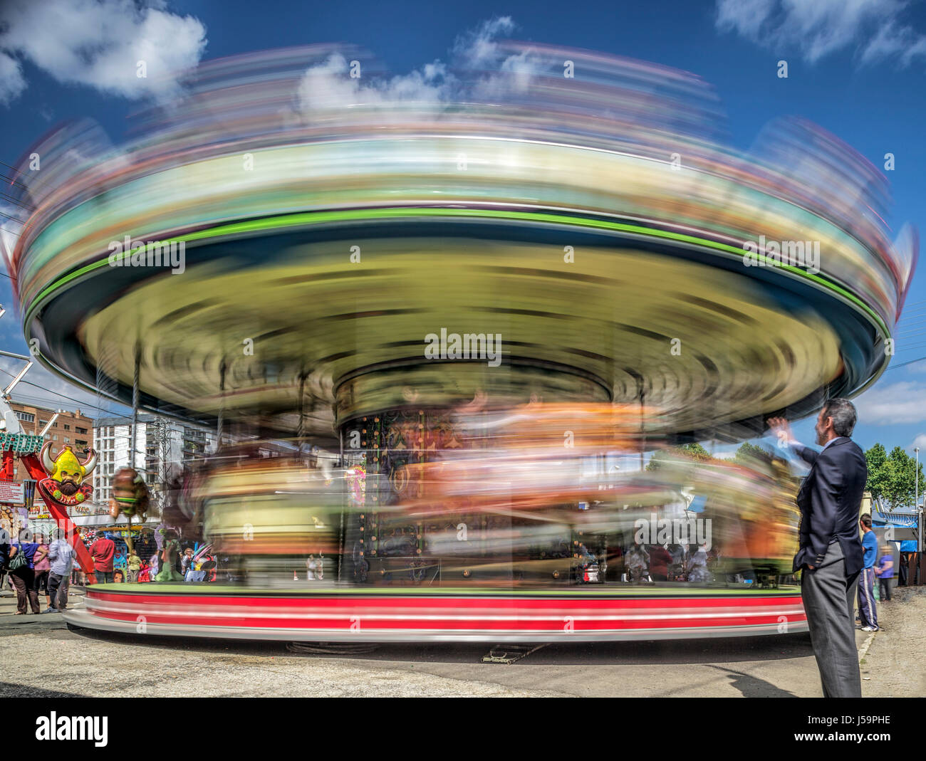 Carousel in a funfair, Feria de Abril, Seville, Spain. Long exposure ...