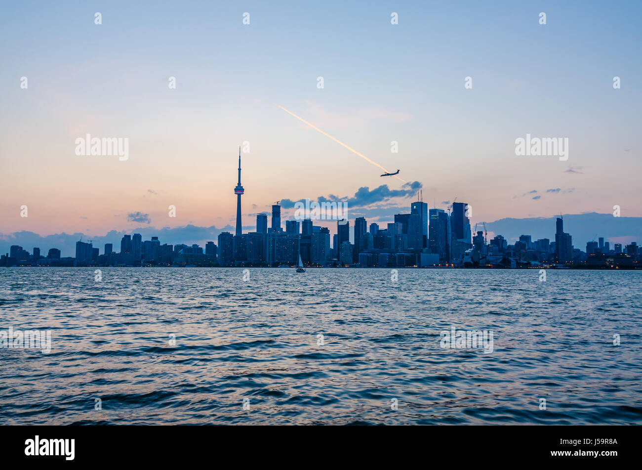 Skyline of Toronto over Ontario Lake at sunset Stock Photo - Alamy