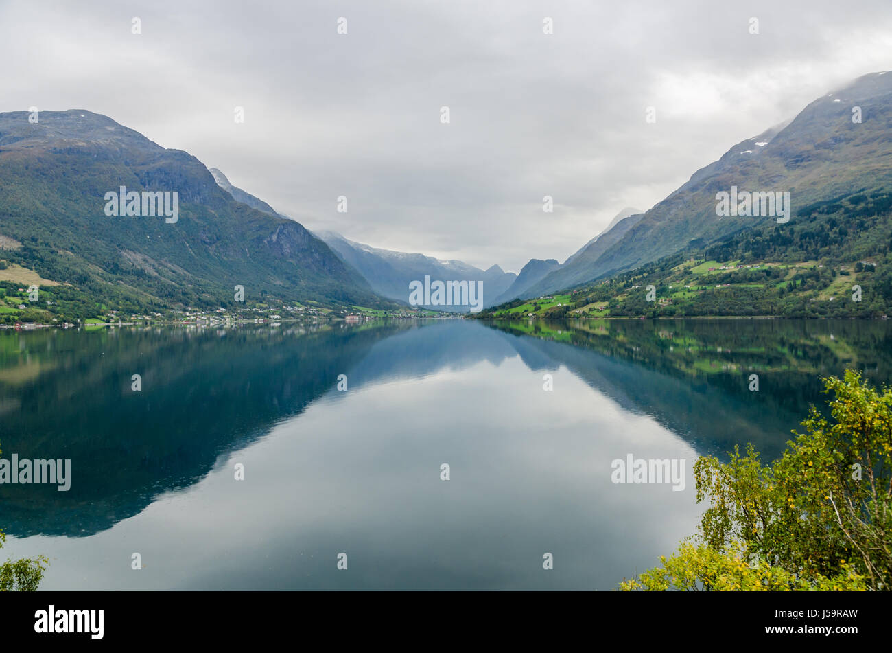 Reflection in Norway fjord at fall time Stock Photo - Alamy