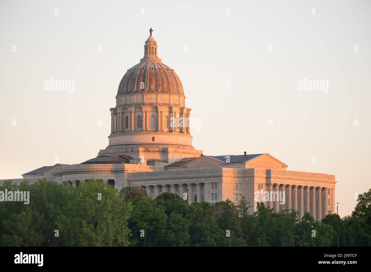 The lights come up as the sun fades on the capital building downtown ...