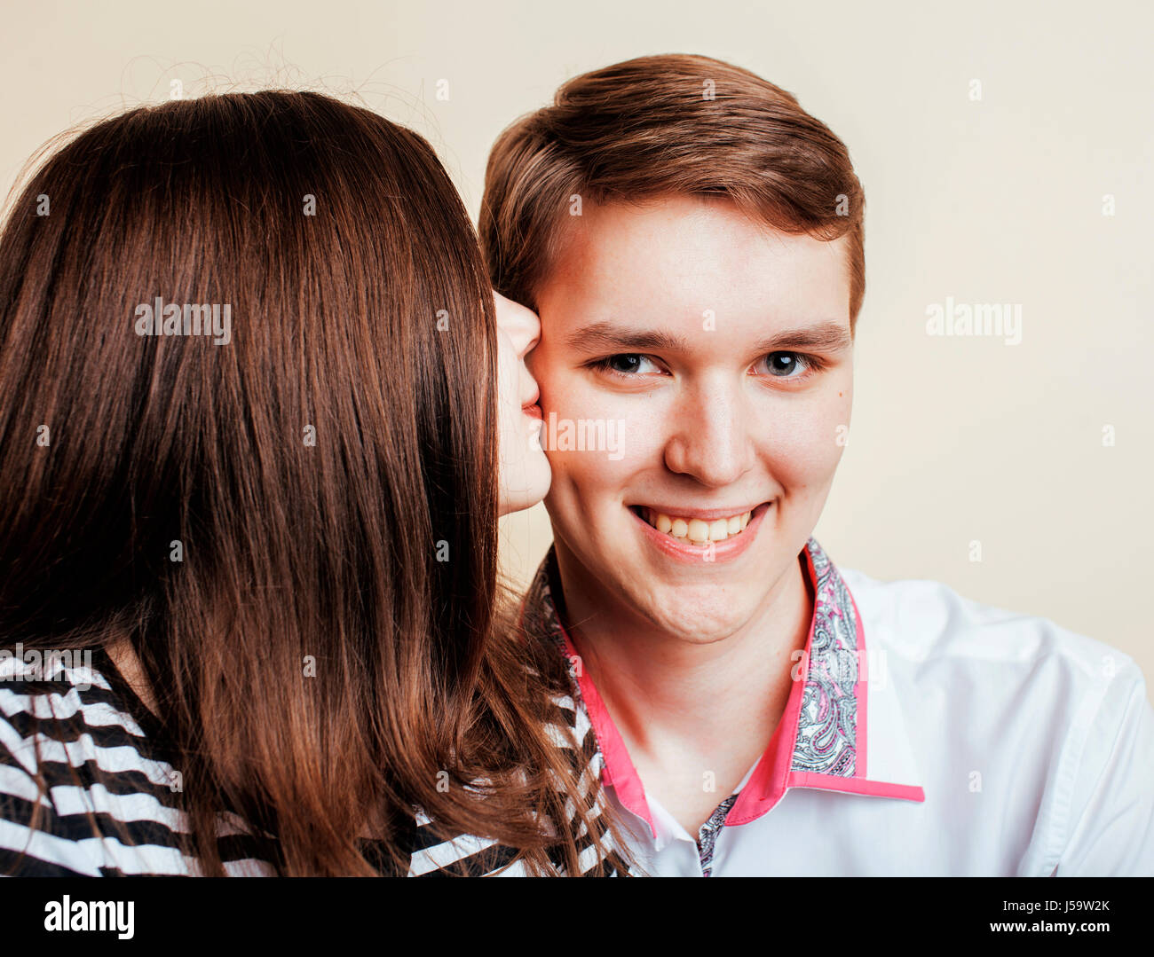 couple of happy smiling teenagers students, warm colors having a Stock ...