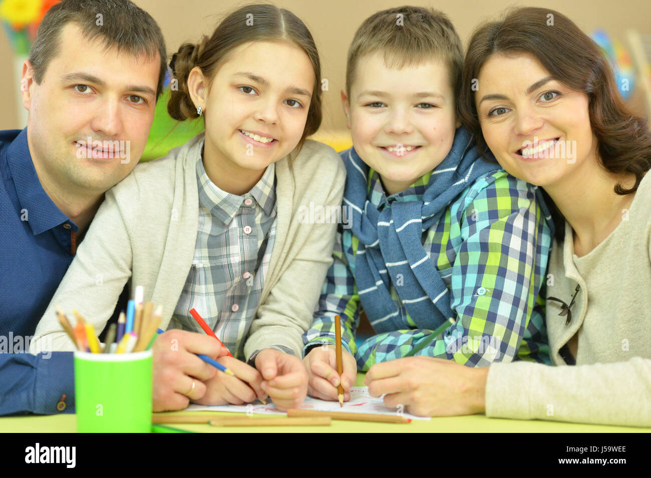 Children draw with their parents Stock Photo - Alamy