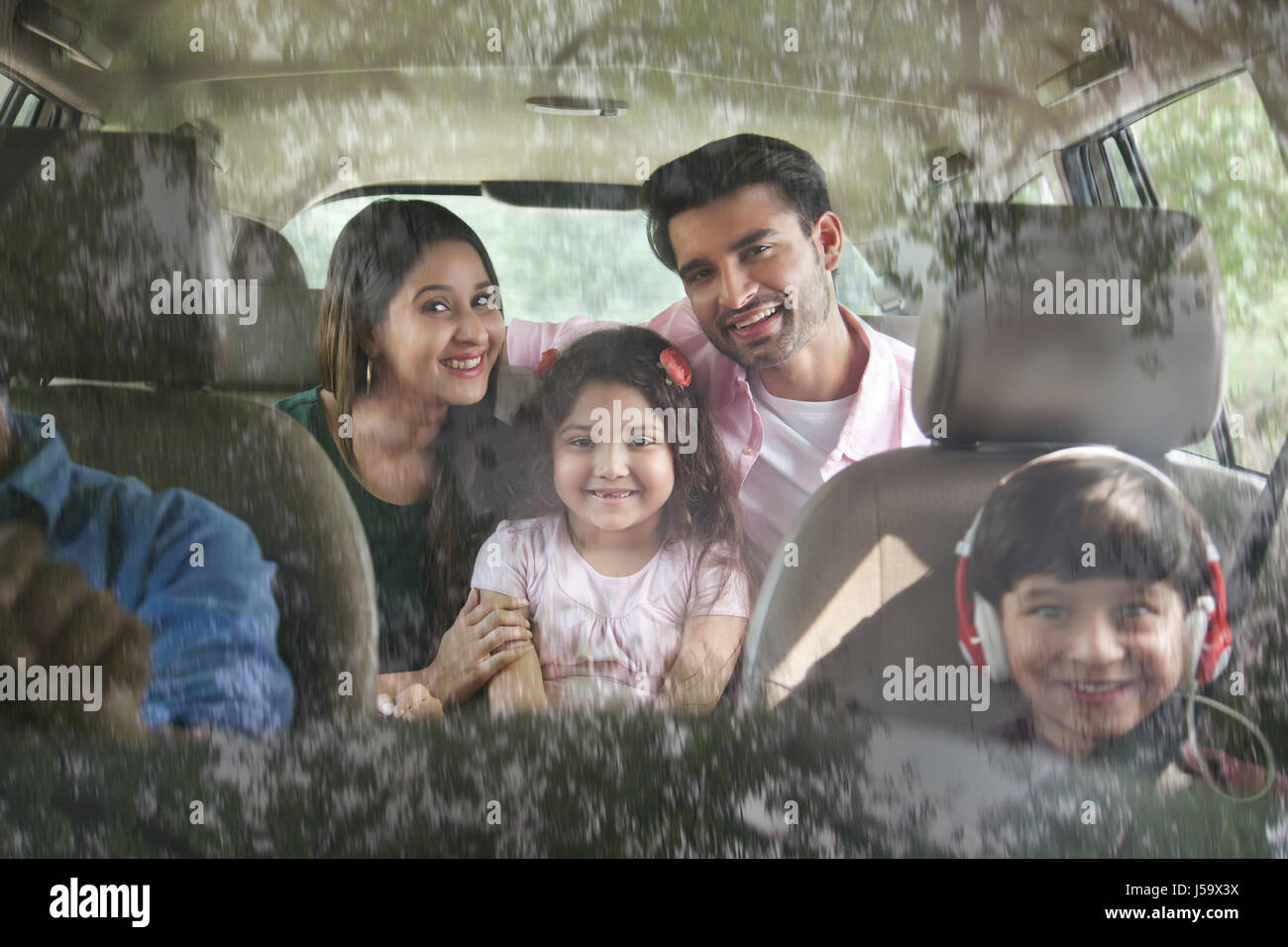 Happy family in car for road trip Stock Photo - Alamy
