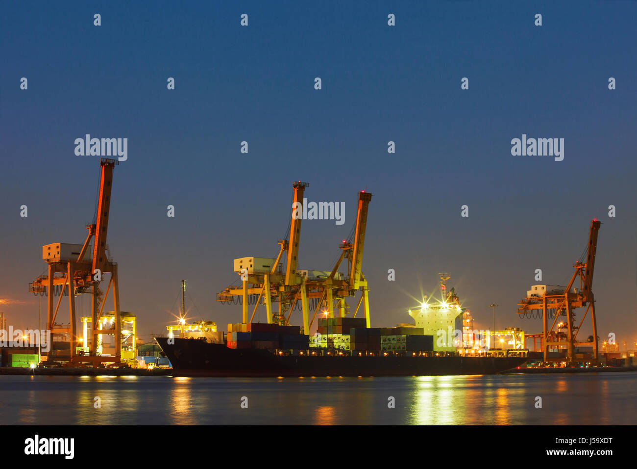 beautiful lighting of freight container comercial ship with ship yard ...