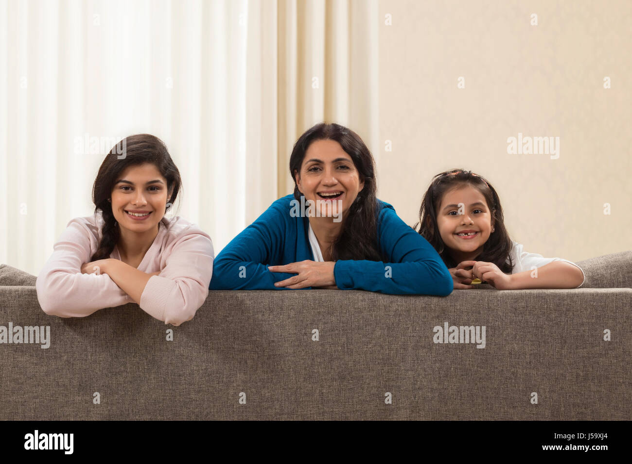 Portrait of happy three generation females Stock Photo - Alamy