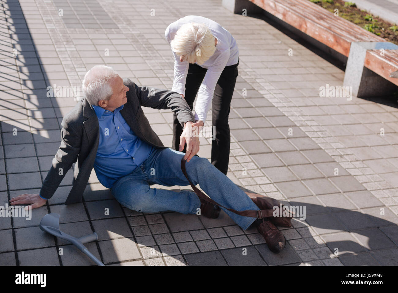 Tired aging man falling down on the road Stock Photo - Alamy