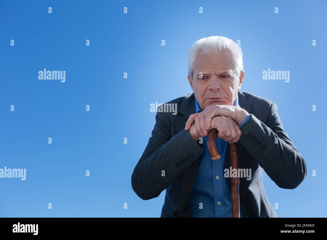 Retired man mulling over his day on the open air Stock Photo - Alamy