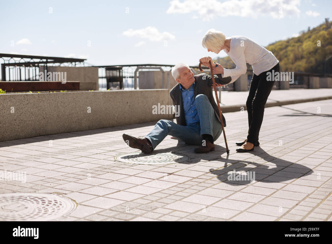 Weak man falling down on the street Stock Photo - Alamy