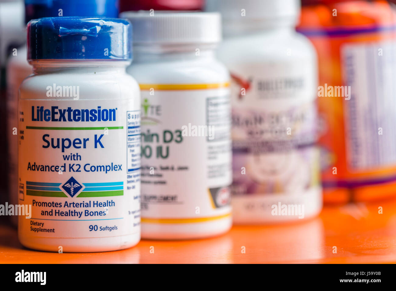 Integrators and health supplements over and orange surface Stock Photo ...