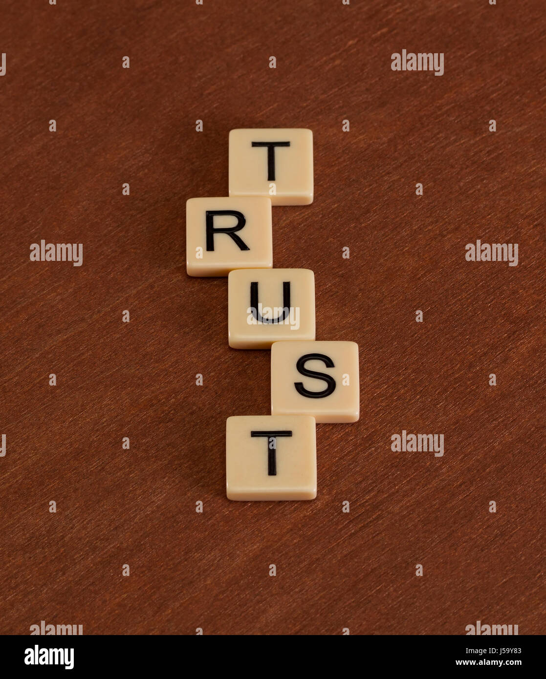 Trust sign. Loyalty concept. Ivory tiles with capital letters on ...