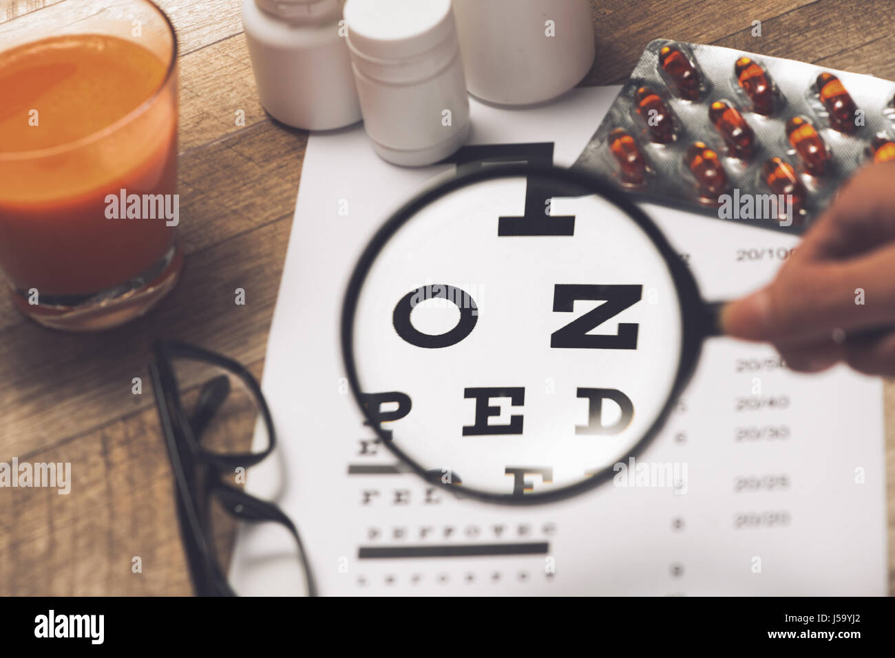 Healthy eyes. Eye chart and medicine Stock Photo - Alamy