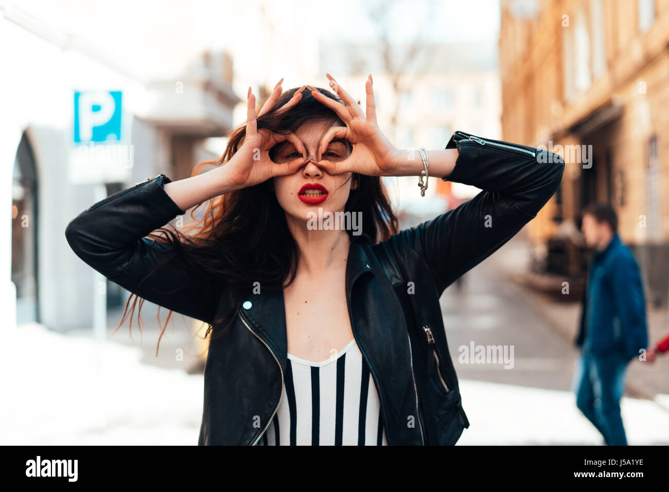 Beautiful fashionable lady posing on old street Stock Photo - Alamy