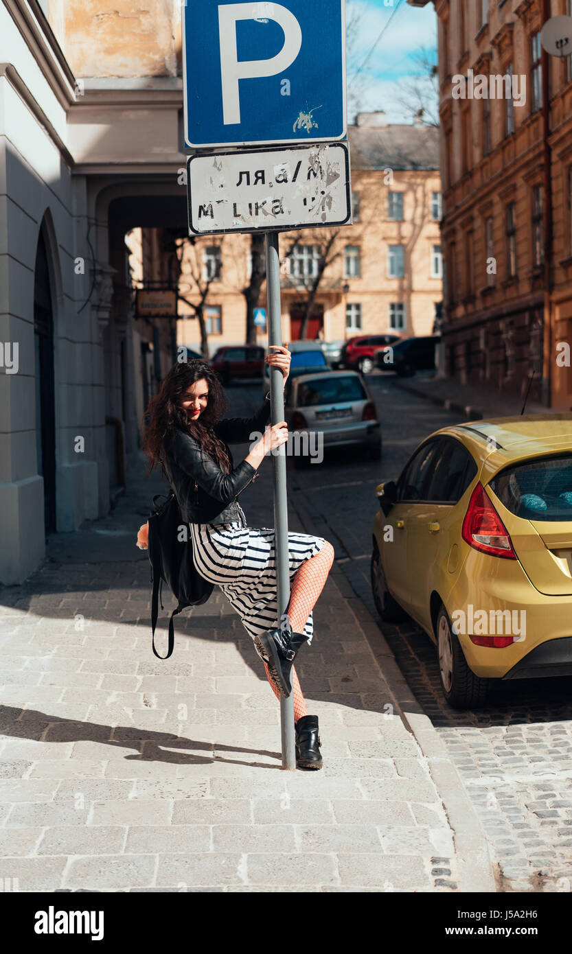 Beautiful fashionable lady posing on old street Stock Photo - Alamy