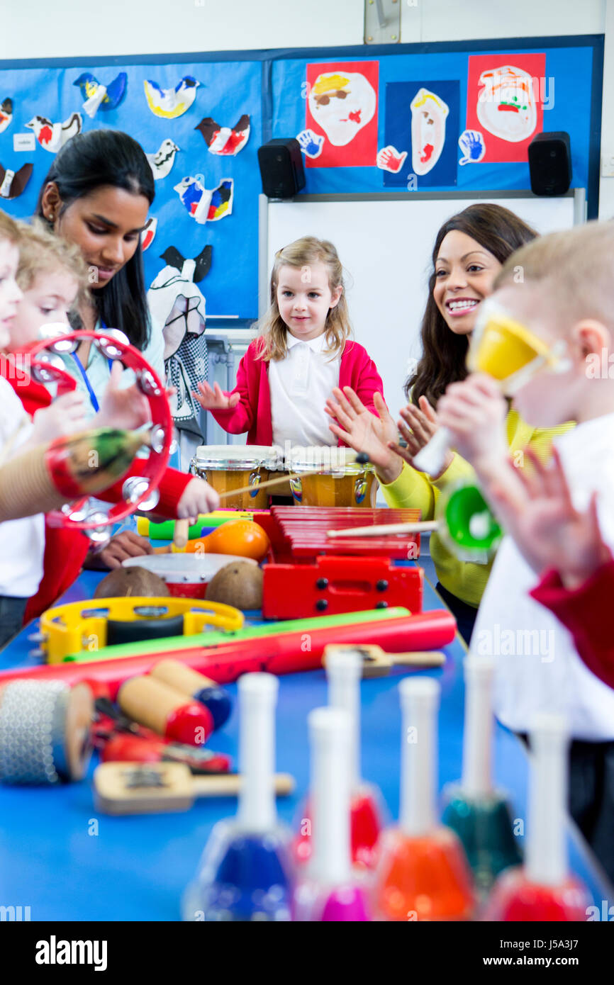 Children playing musical instruments hi-res stock photography and ...