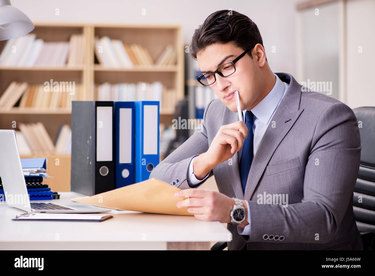 Businessman receiving letter in the office Stock Photo - Alamy