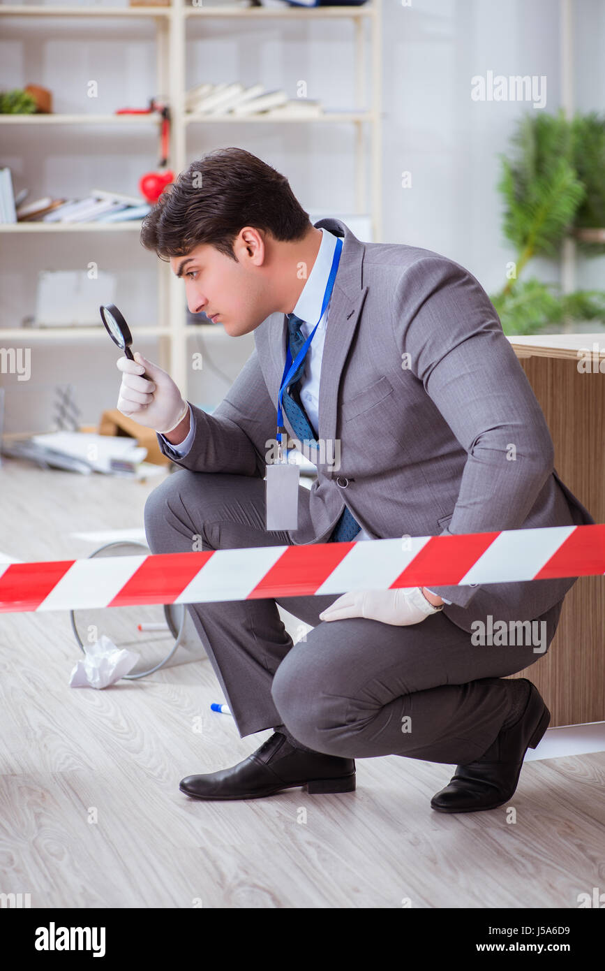Young man during crime investigation in office Stock Photo - Alamy