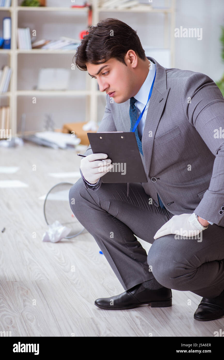 Young man during crime investigation in office Stock Photo - Alamy