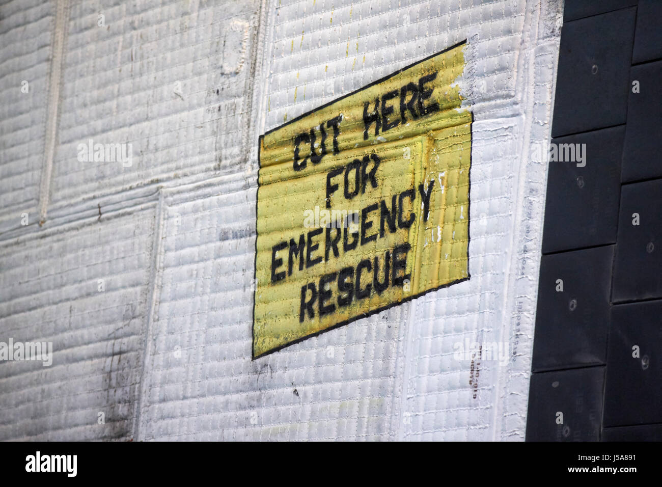 cut here for emergency rescue sign on flexible insulation blanket tiles ...