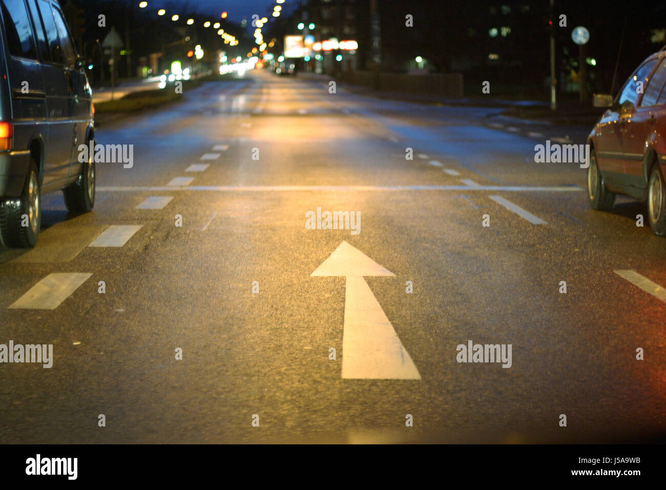 sign signal drive night nighttime track signpost straight ahead follow ...