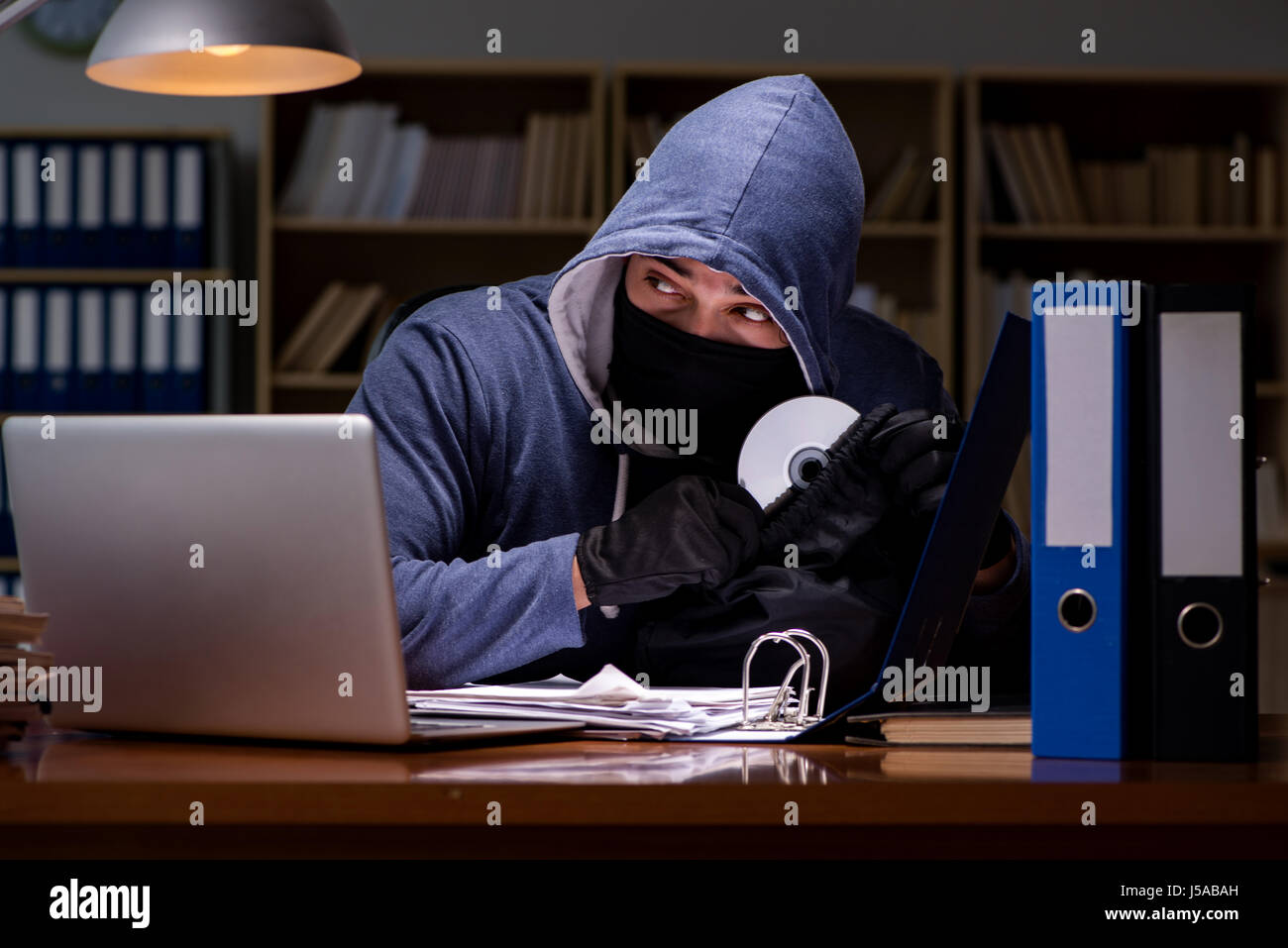Hacker stealing personal data from home computer Stock Photo - Alamy