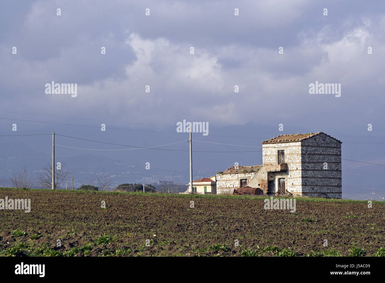 house on the field Stock Photo - Alamy