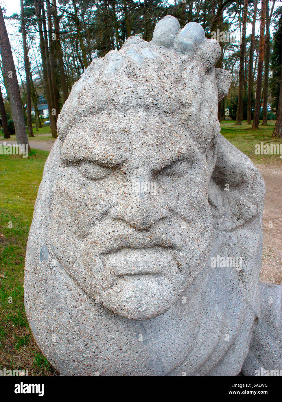 detail park stone sculpture frontally raving furious angry irately ...