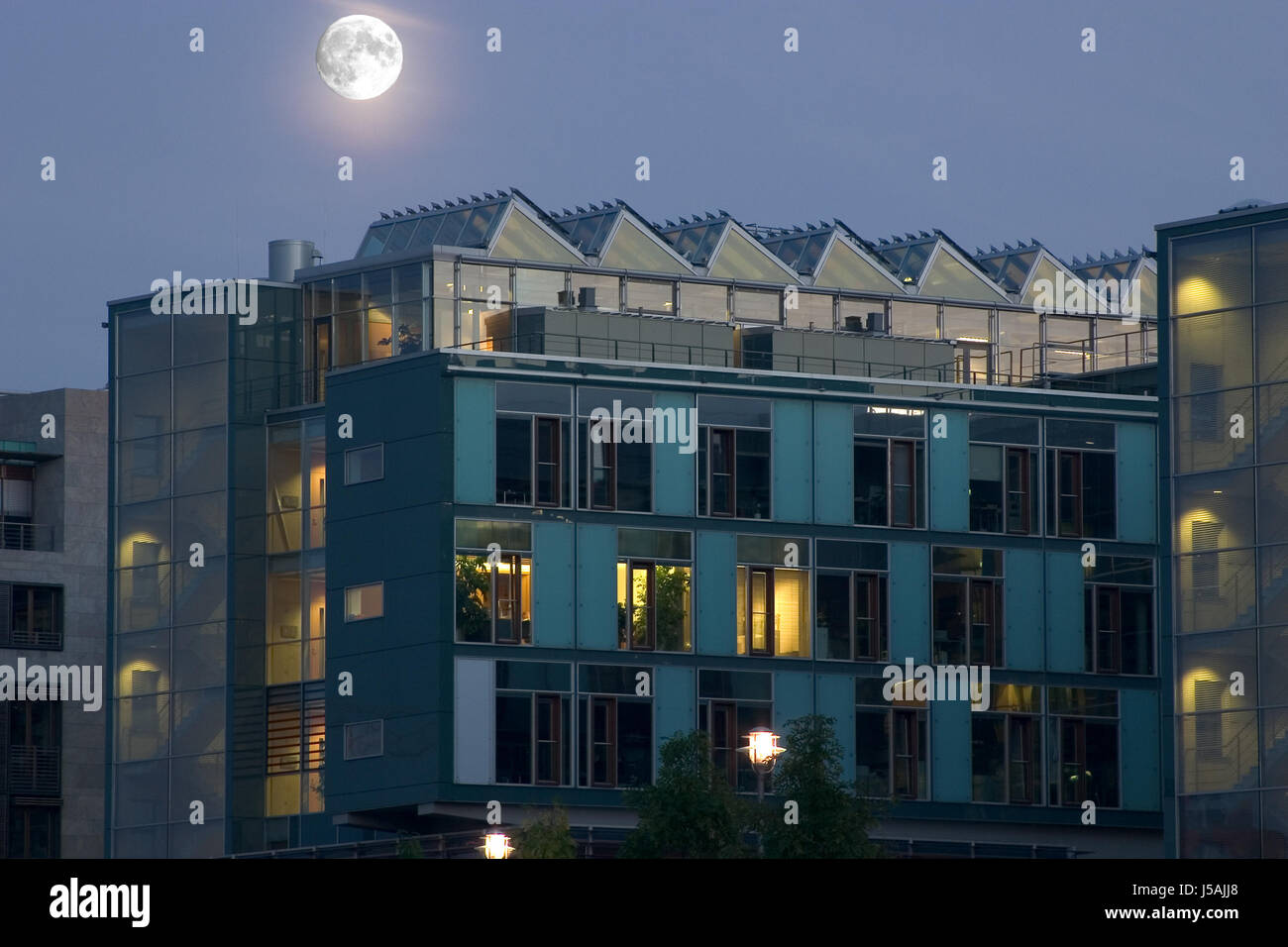 moon above residential buildings Stock Photo - Alamy
