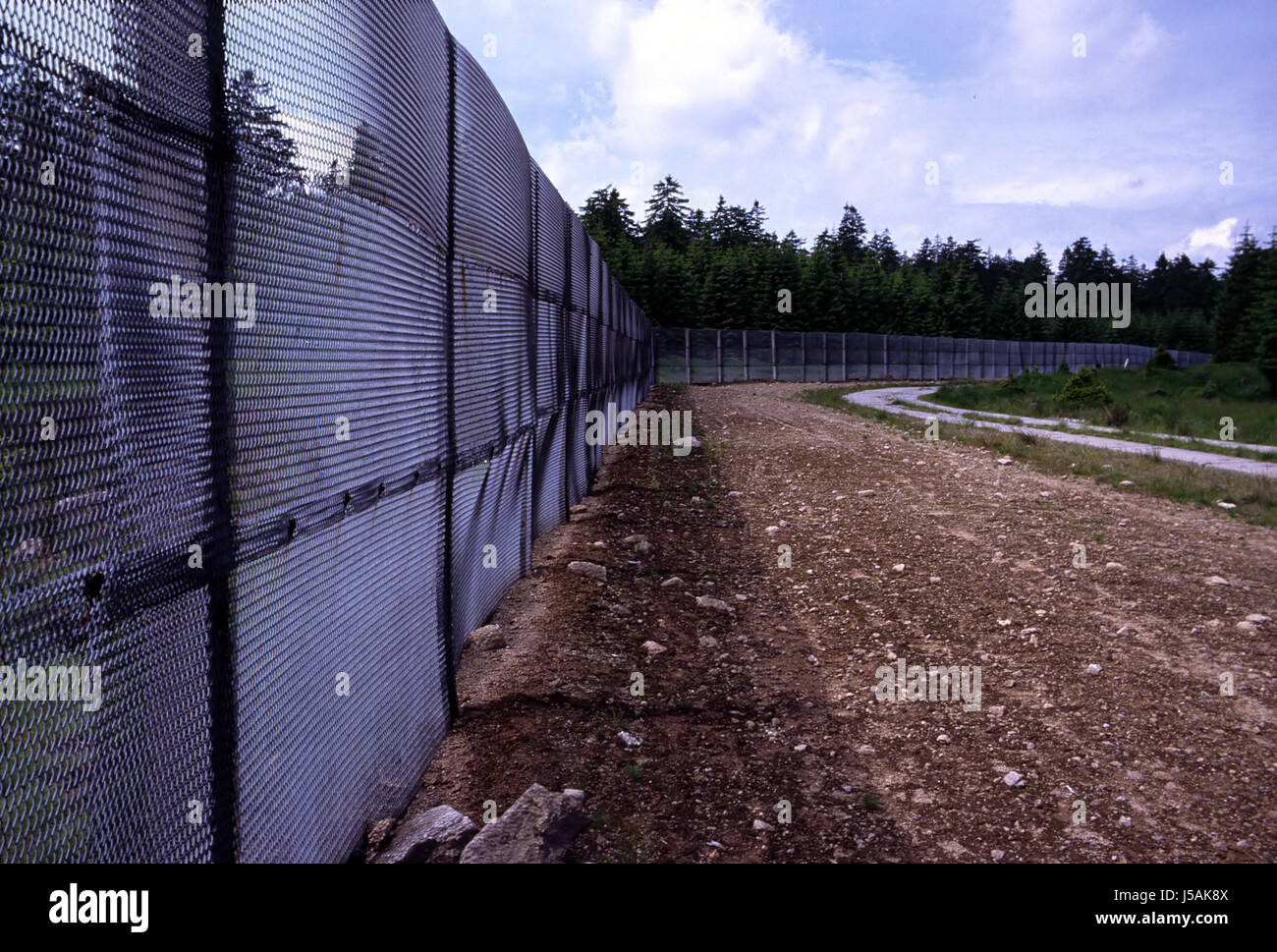 Divided by fence hi-res stock photography and images - Alamy