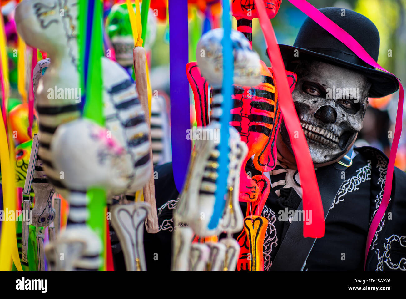 A Mexican man, dressed as skeleton (Calaca), takes part in the Day of ...