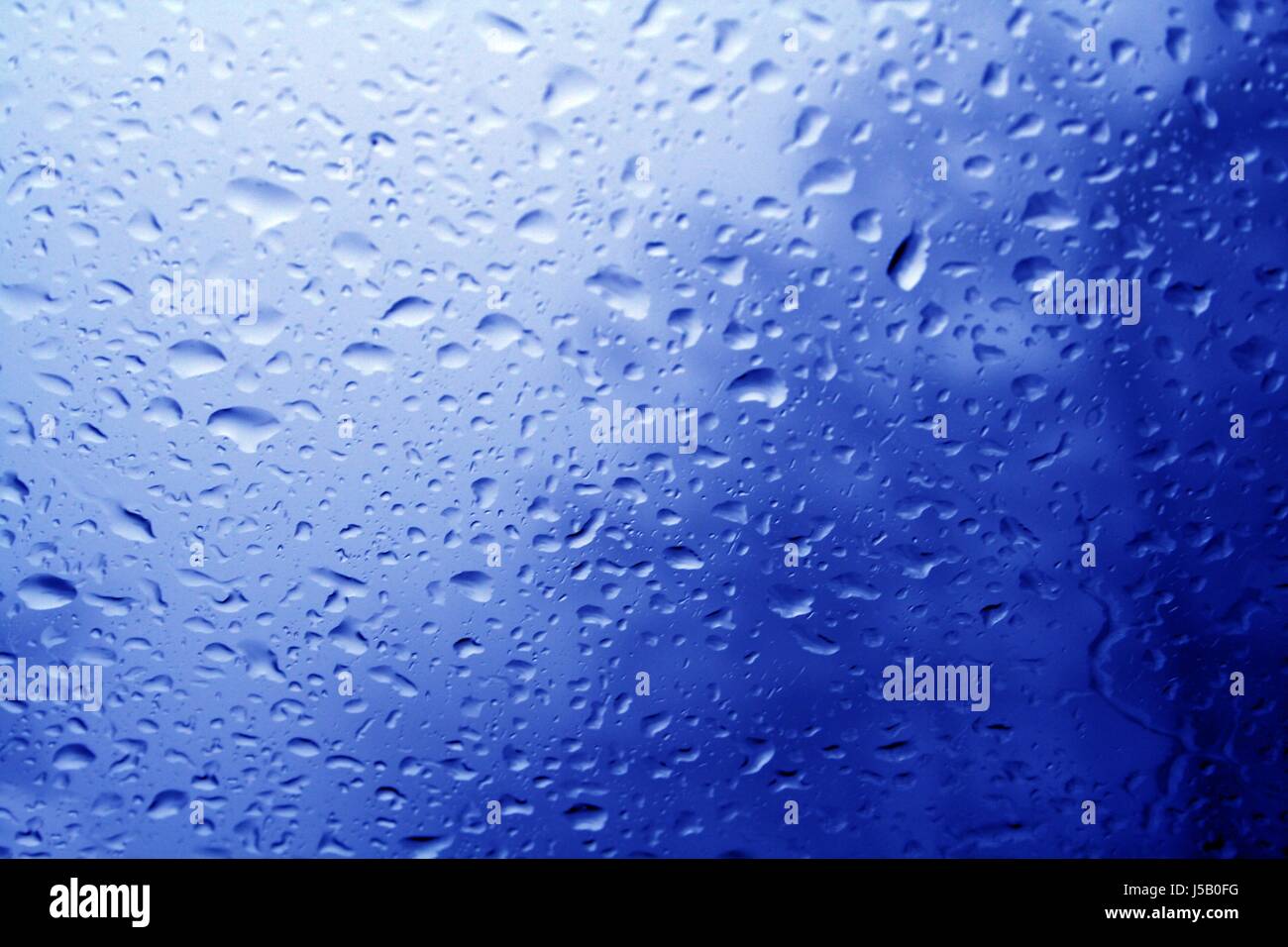 window porthole dormer window pane cold raindrop disc wet pearls water ...