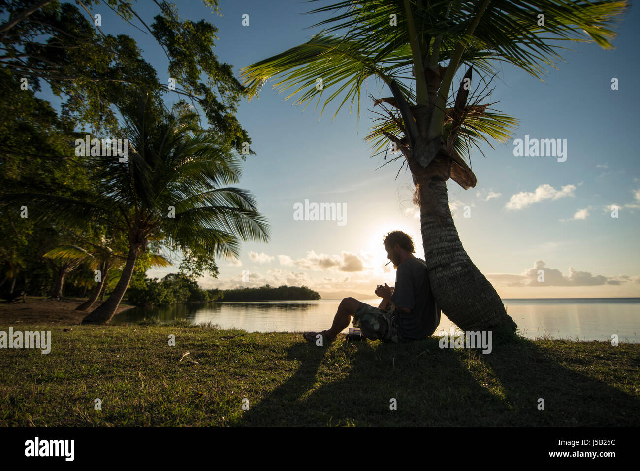 Beach smoking cigarette tropical hi-res stock photography and images ...