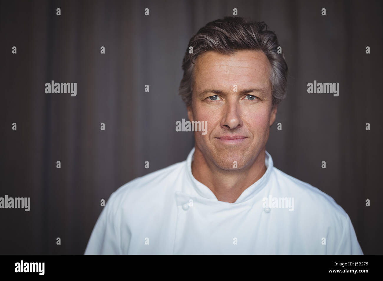 Portrait of handsome chef in restaurant Stock Photo - Alamy