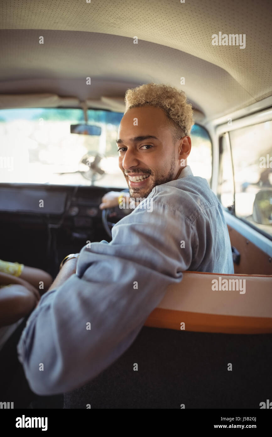 Portrait of smiling young man driving van Stock Photo - Alamy