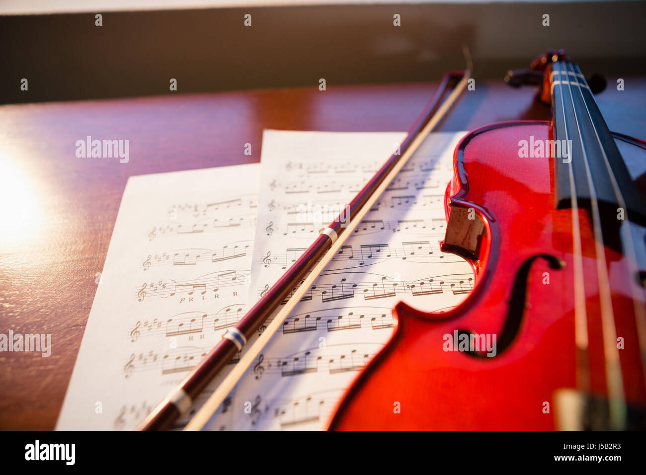 High angle view of violin with sheet music on table at classroom Stock ...