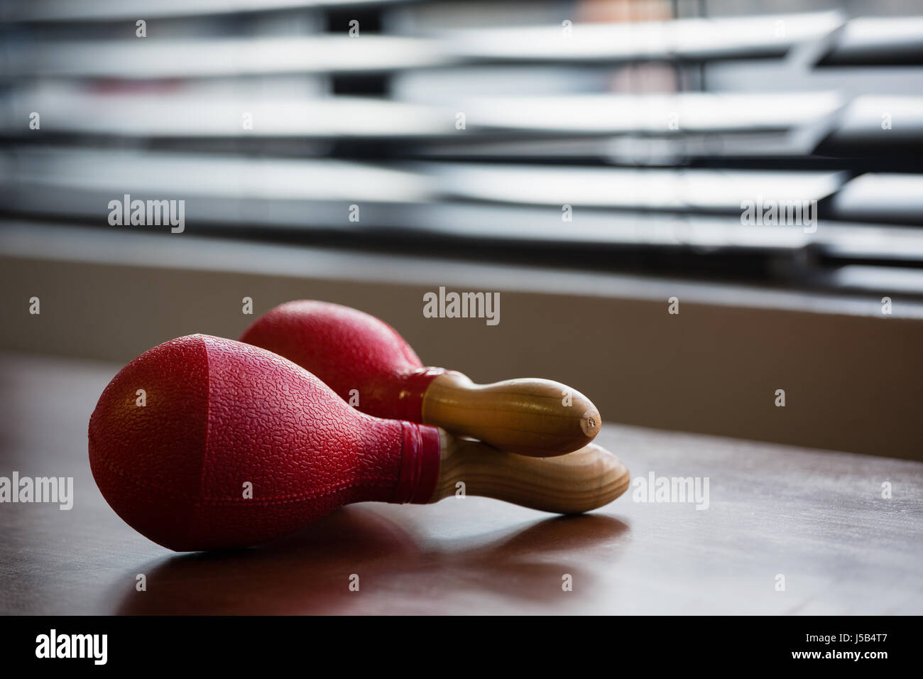 Close up of maracas on table in classroom Stock Photo - Alamy