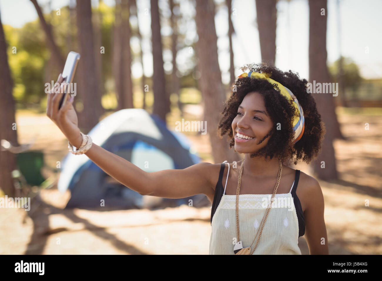 Woman using clicking phone green hi-res stock photography and images ...