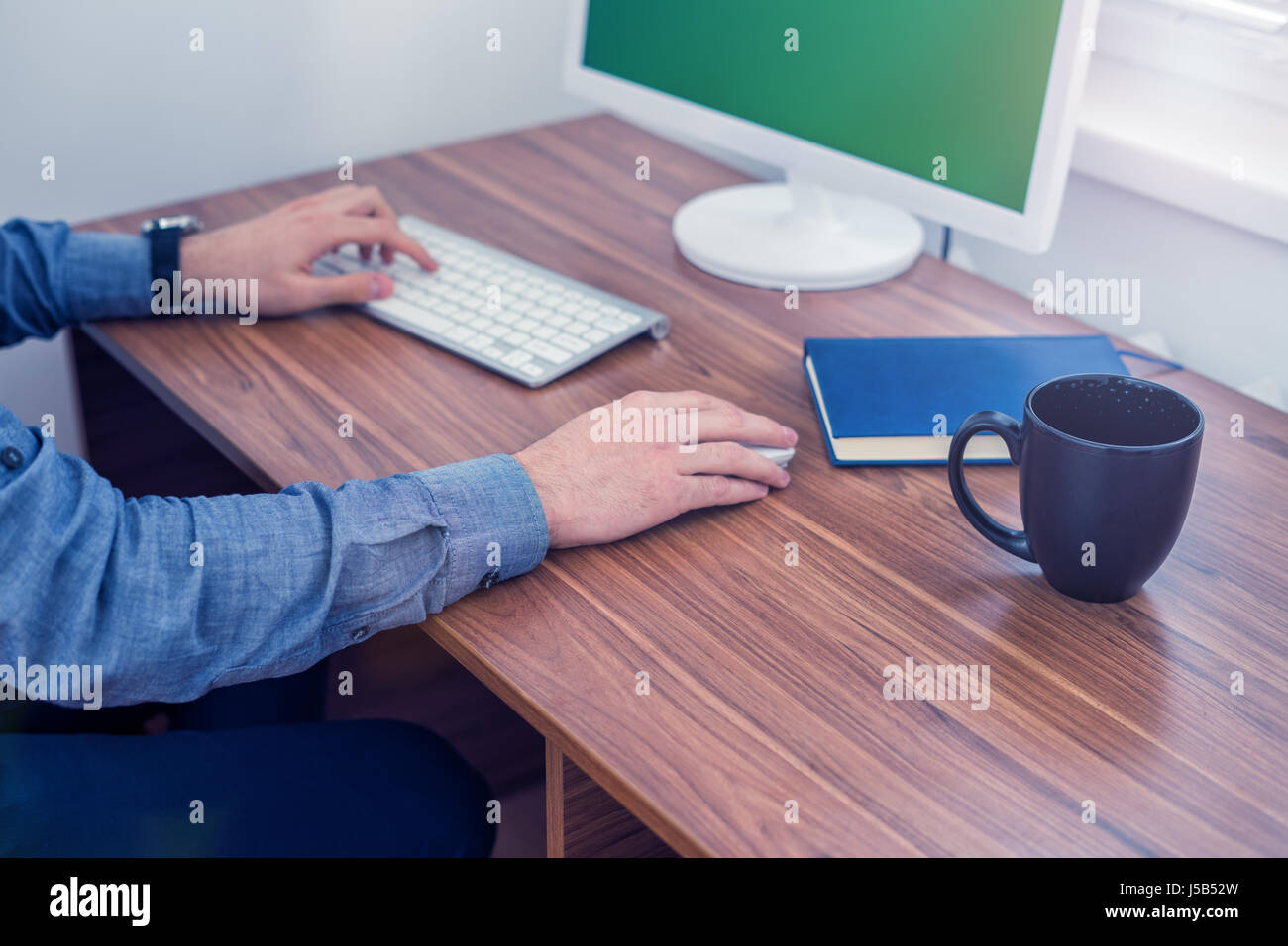 Hands of office man working at computer desk Stock Photo - Alamy